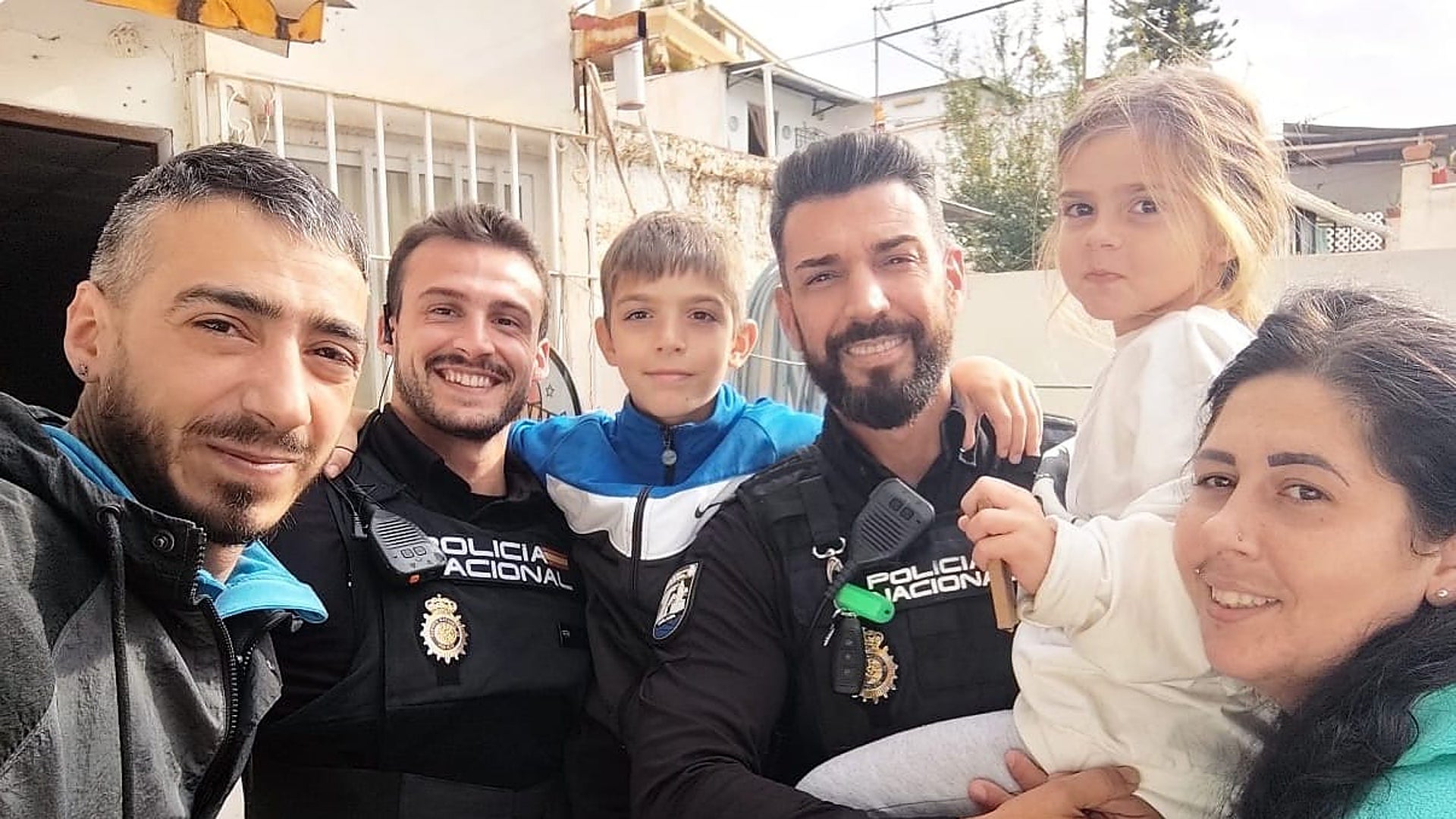 Two brave police officers rescue family trapped by rising flood water ...